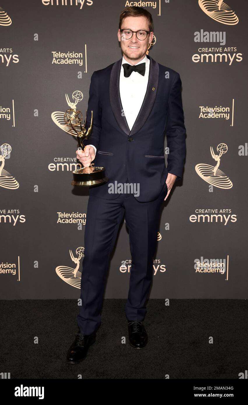 Michael Cheeseman poses with the Emmy for outstanding cinematography ...