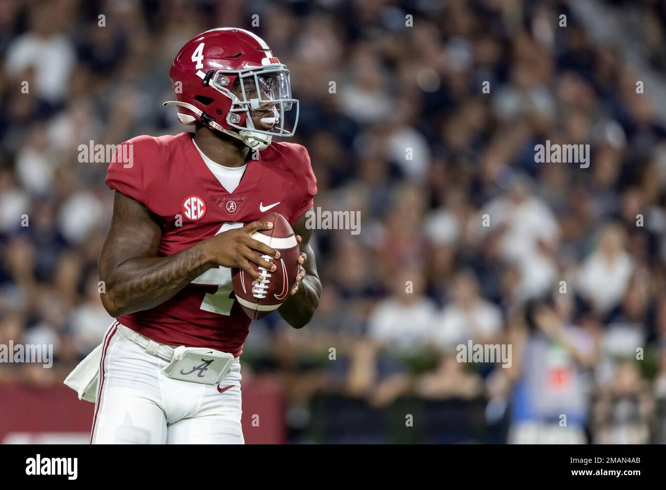 Alabama quarterback Jalen Milroe rolls out to throw against Utah State ...
