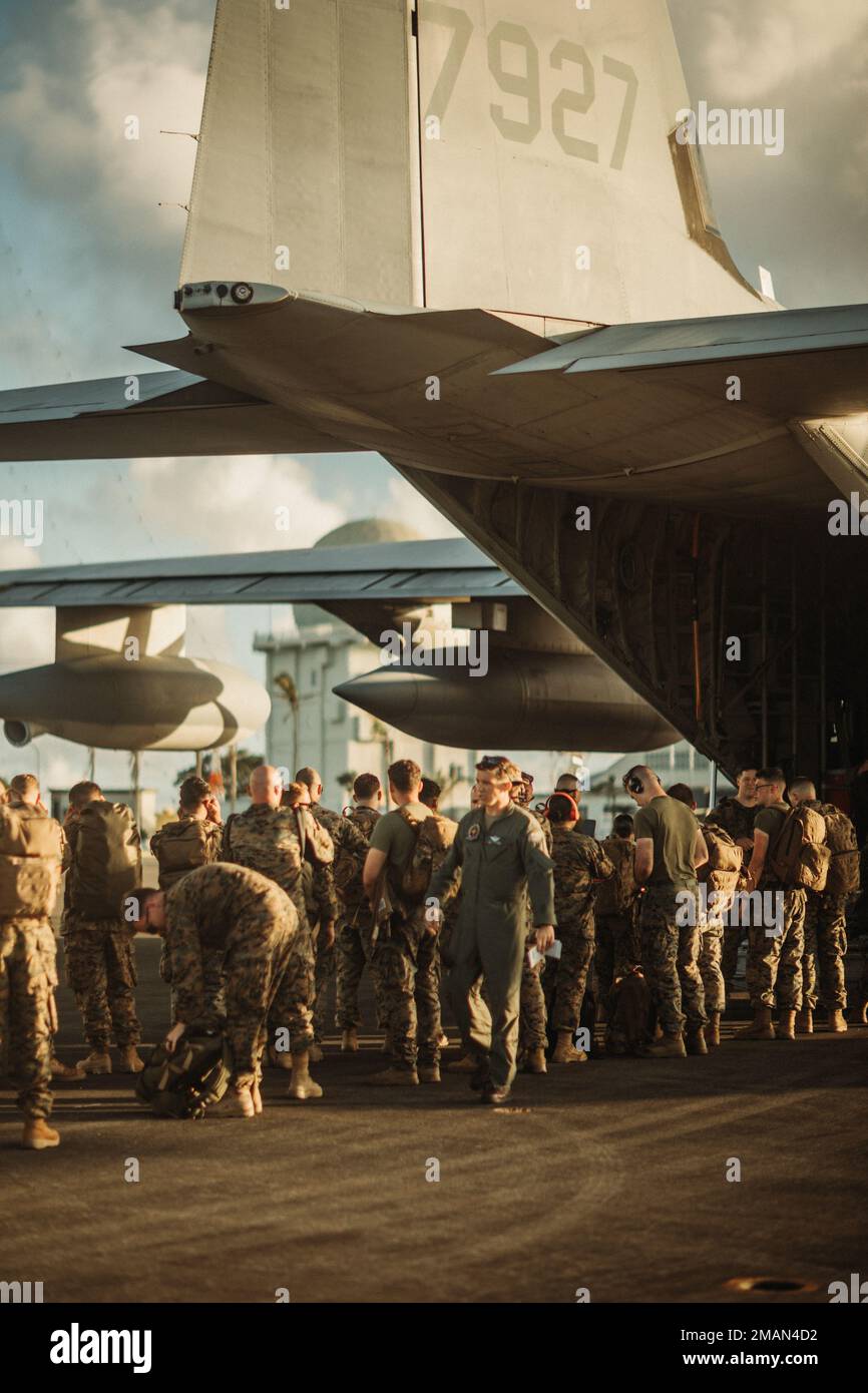 U.S. Marines embark on a U.S. Marine Corps KC-130J Hercules aircraft at ...