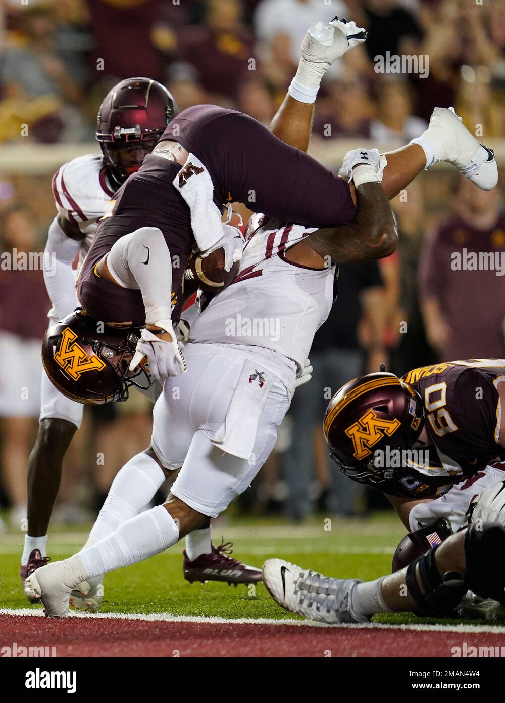 Minnesota running back Trey Potts is tackled during the second half of ...