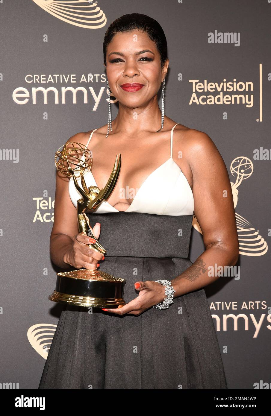 Mia Neal poses with the Emmy for outstanding hairstyling for a variety ...
