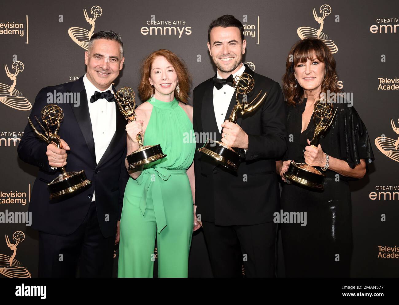Raj Kapoor, Tara Montgomery and Ben Winston, pose with the Emmy for ...