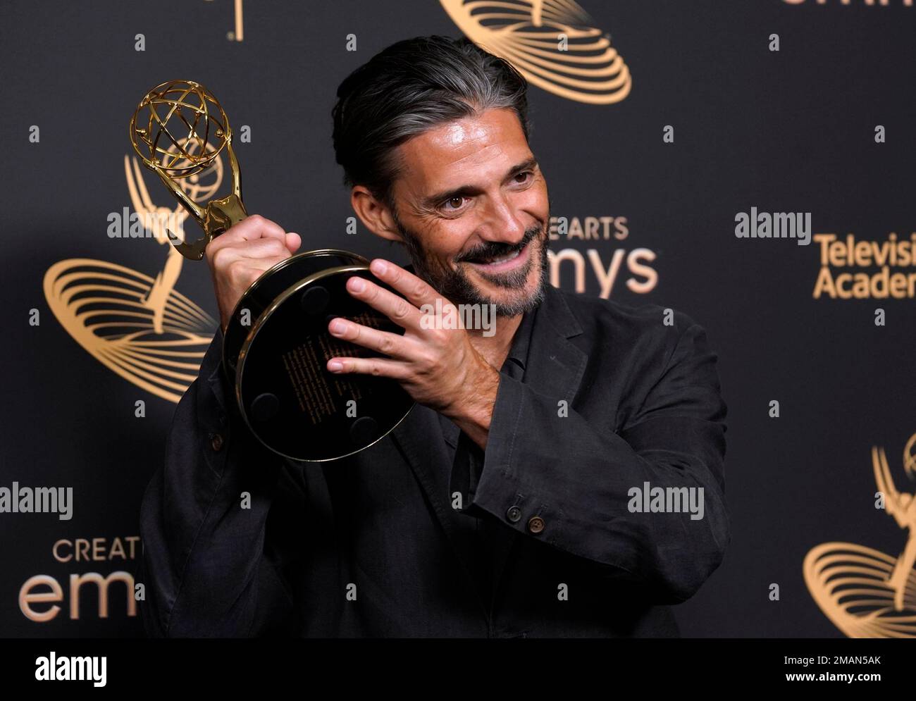 Alberto Mielgo poses in the press room with the award for outstanding ...