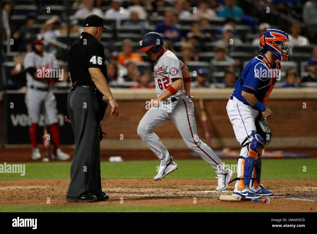 Washington Nationals' Alex Call (62) scores against the New York Mets ...