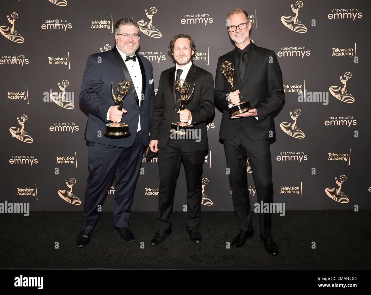 Matthew Cotter, Noah Mitz, and Bryan Klunder pose with the Emmy for ...