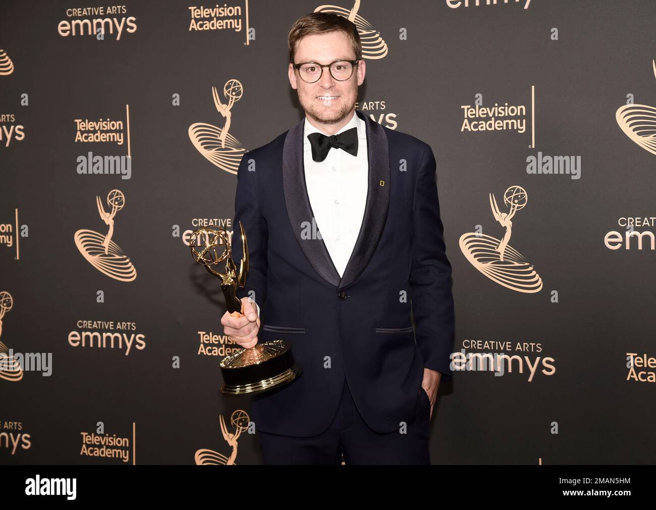 Michael Cheeseman poses with the Emmy for outstanding cinematography ...