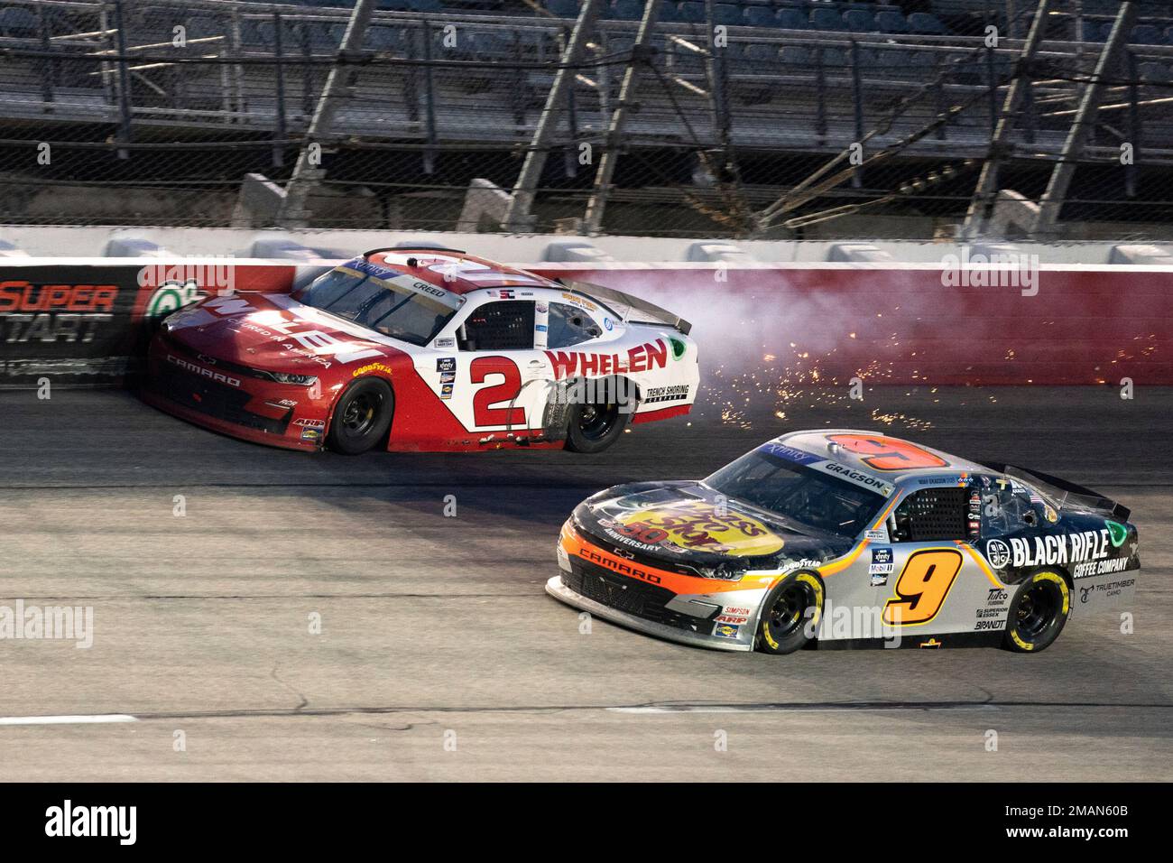 Noah Gragson (9) passes Sheldon Creed (2) on the final turn to win the ...