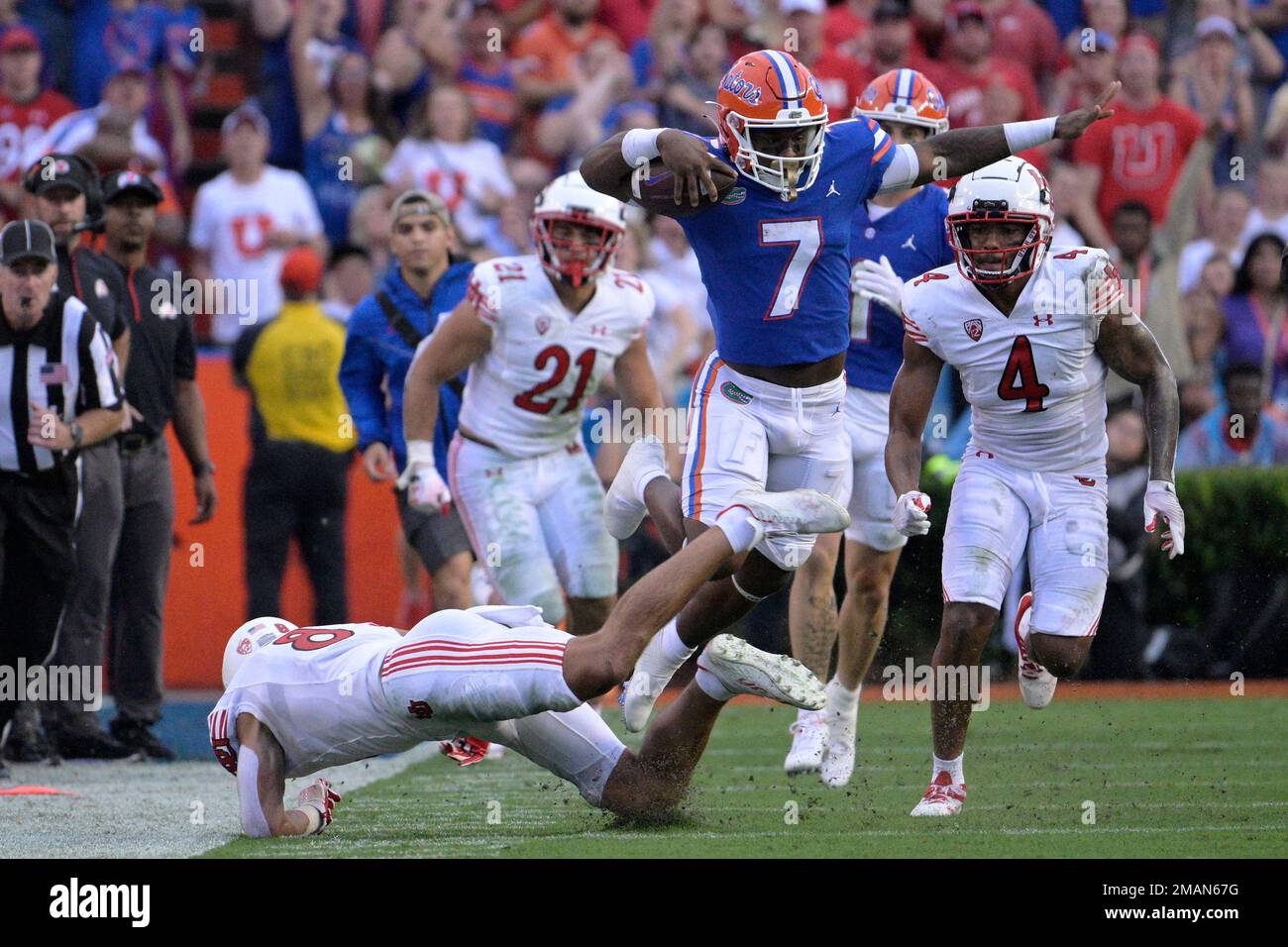 Florida running back Trevor Etienne (7) leaps over Utah safety Cole ...