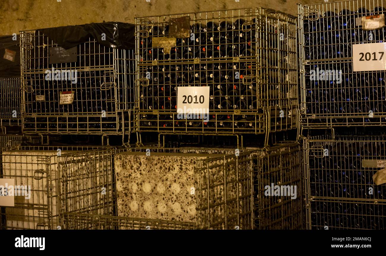 Glass bottles in pile of champagne bottles during of traditional ...