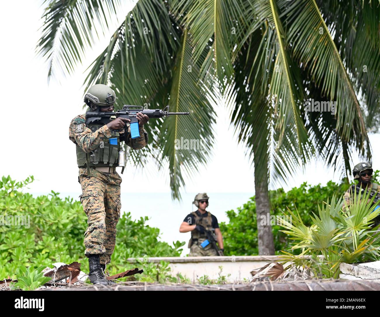 A member of the Royal Bahamas Defense Force provides security during a ...
