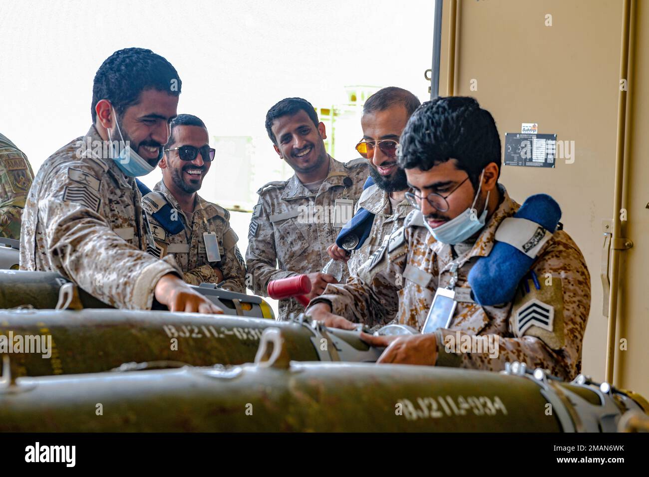 Royal Saudi Air Force service members assemble an American Joint Direct ...