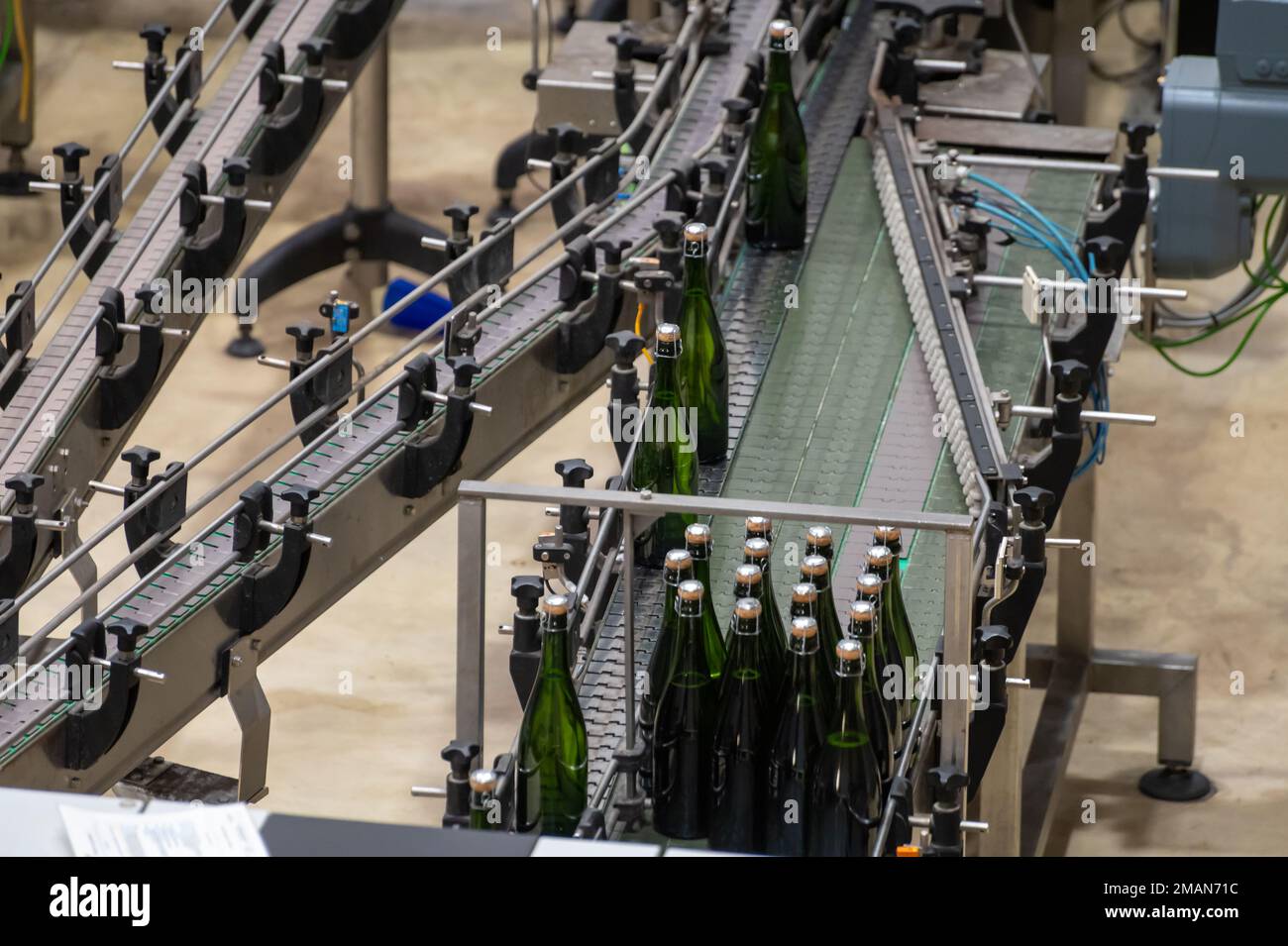 Production of cremant sparkling wine in Burgundy, France. Automatically ...
