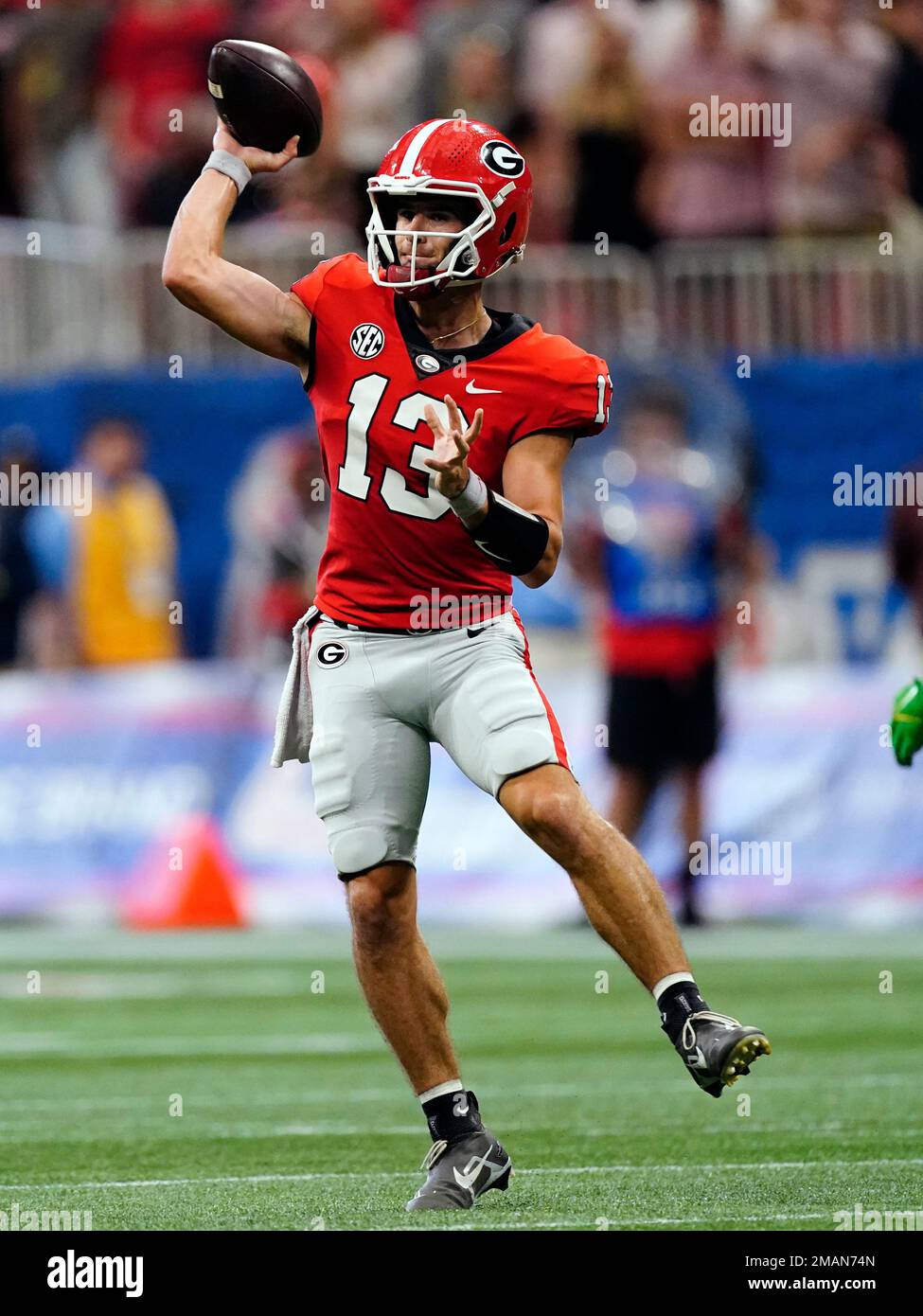 Georgia quarterback Stetson Bennett (13) throws on the run in the first ...
