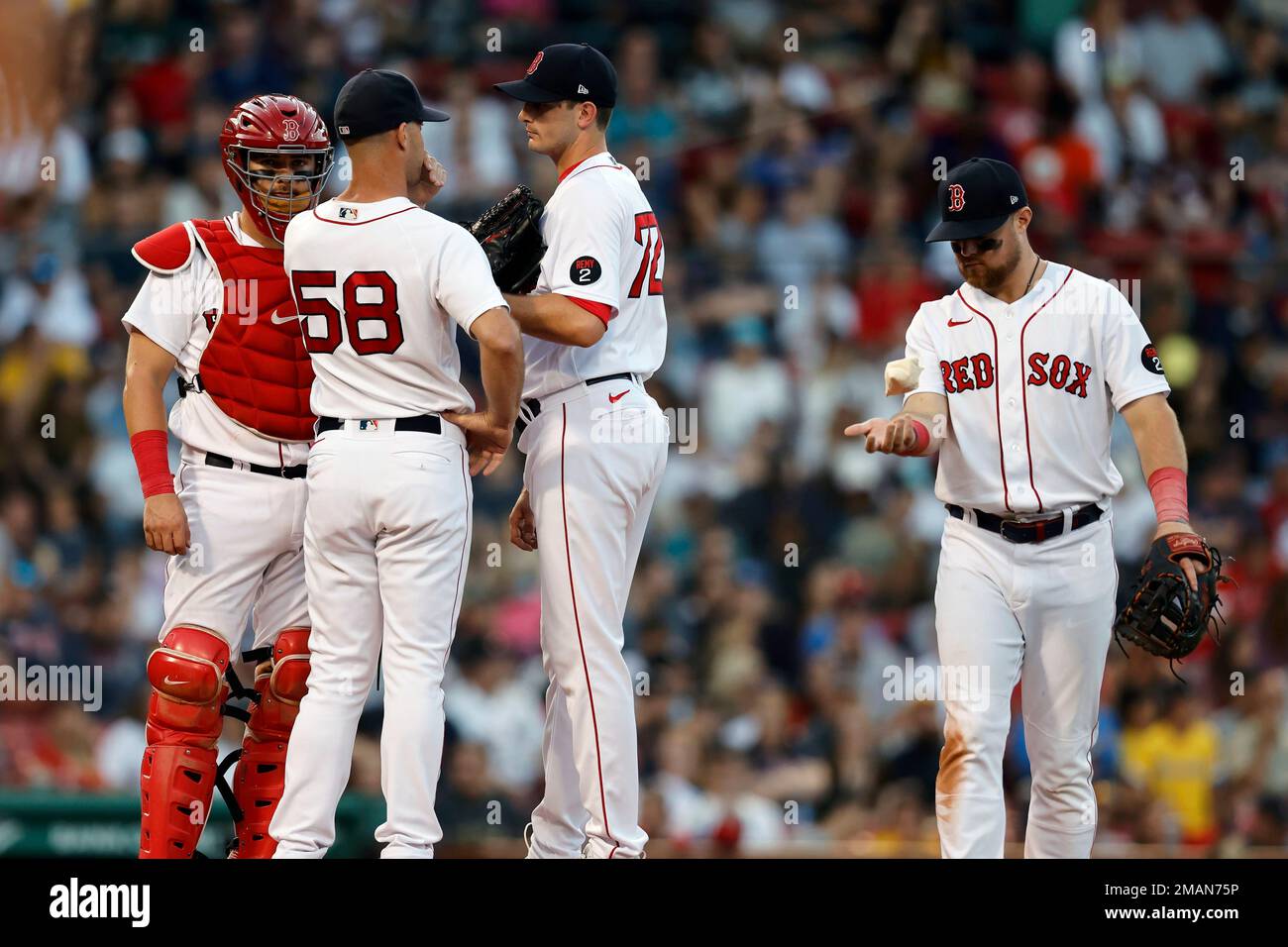 Boston Red Sox pitching coach Dave Bush (58) talks with Garrett ...