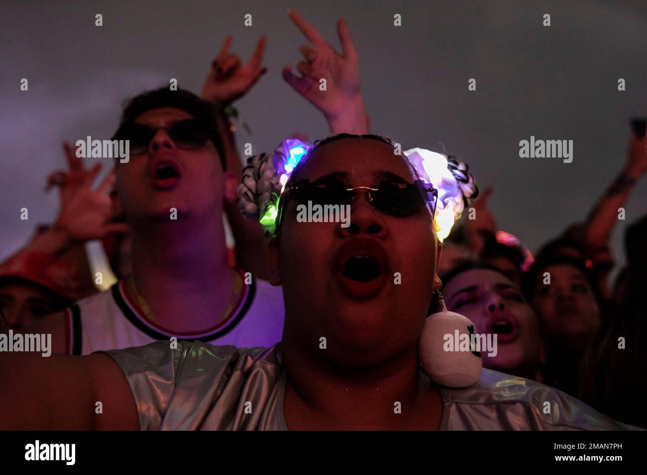 Music fans cheer during the performance of the Brazilian DJ Alok at the ...