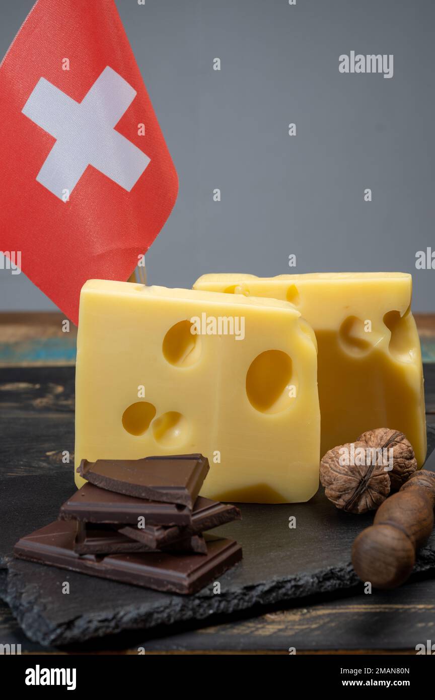 Swiss food, medium-hard cow milk cheese emmentaler with holes, dark ...