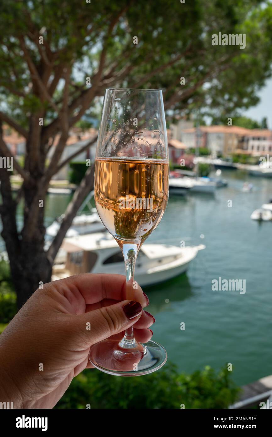 Summer party, drinking of French brut rose champagne sparkling wine in ...