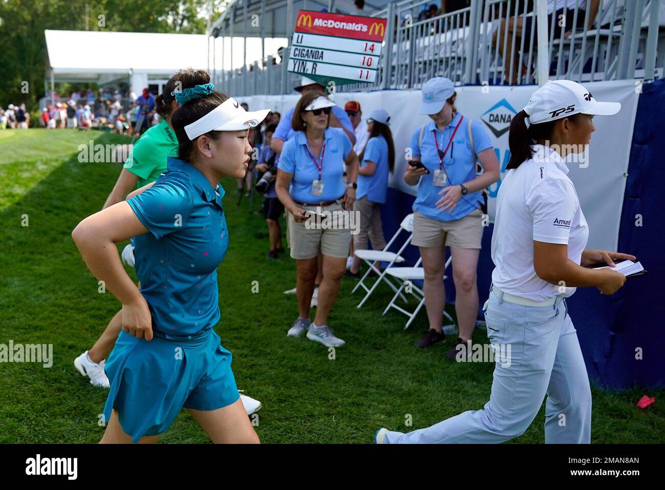 Lucy Li, left, and Ruoning Yin, right, head to the scorer's tent after ...