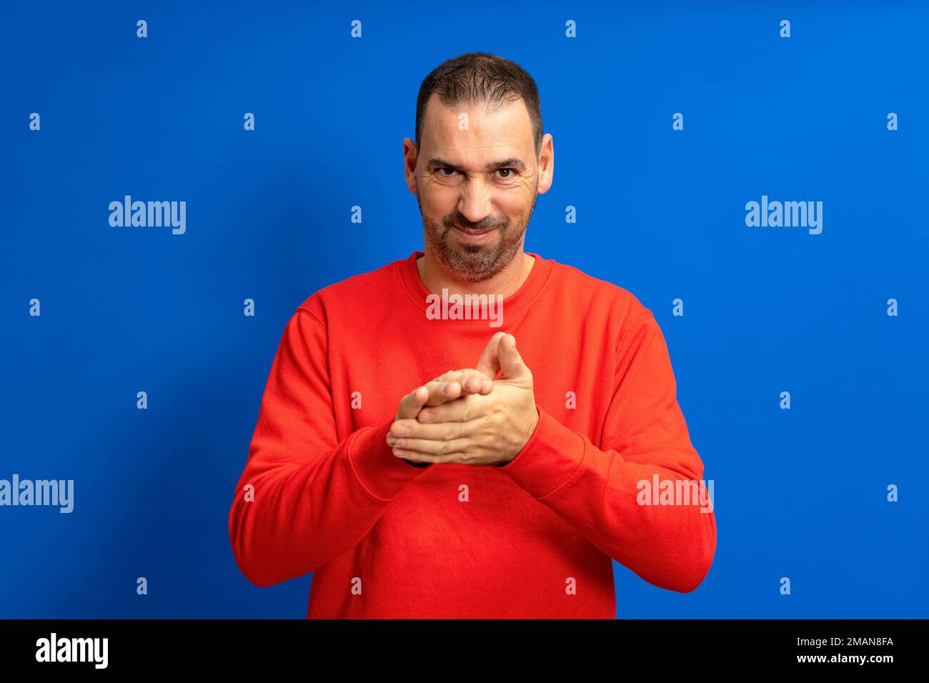 Latino handsome man feeling proud, mischievous and arrogant while ...