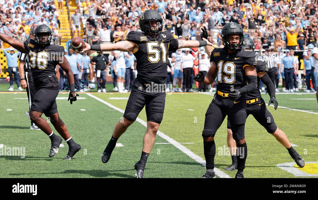 Appalachian State linebacker Tyler Bird (51) celebrates with teammates ...