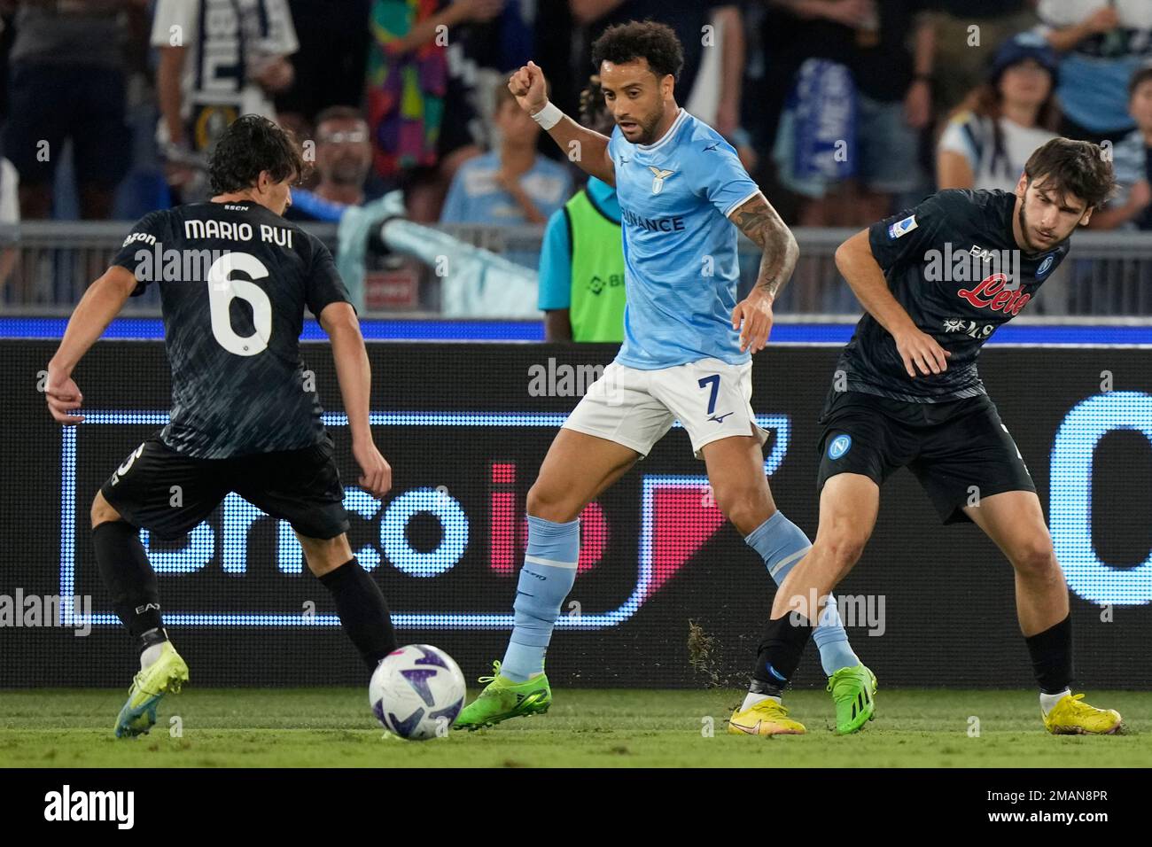 Lazio's Felipe Anderson, centre, challenges for the ball with Napoli's ...