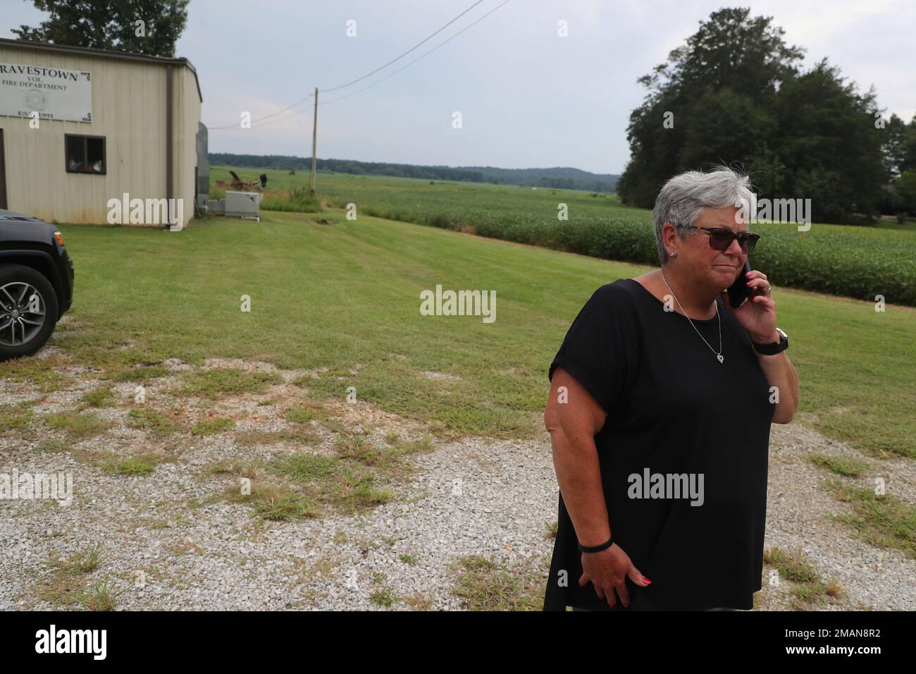 Jane Alsup, right, talks on the phone about the airplane that crash ...