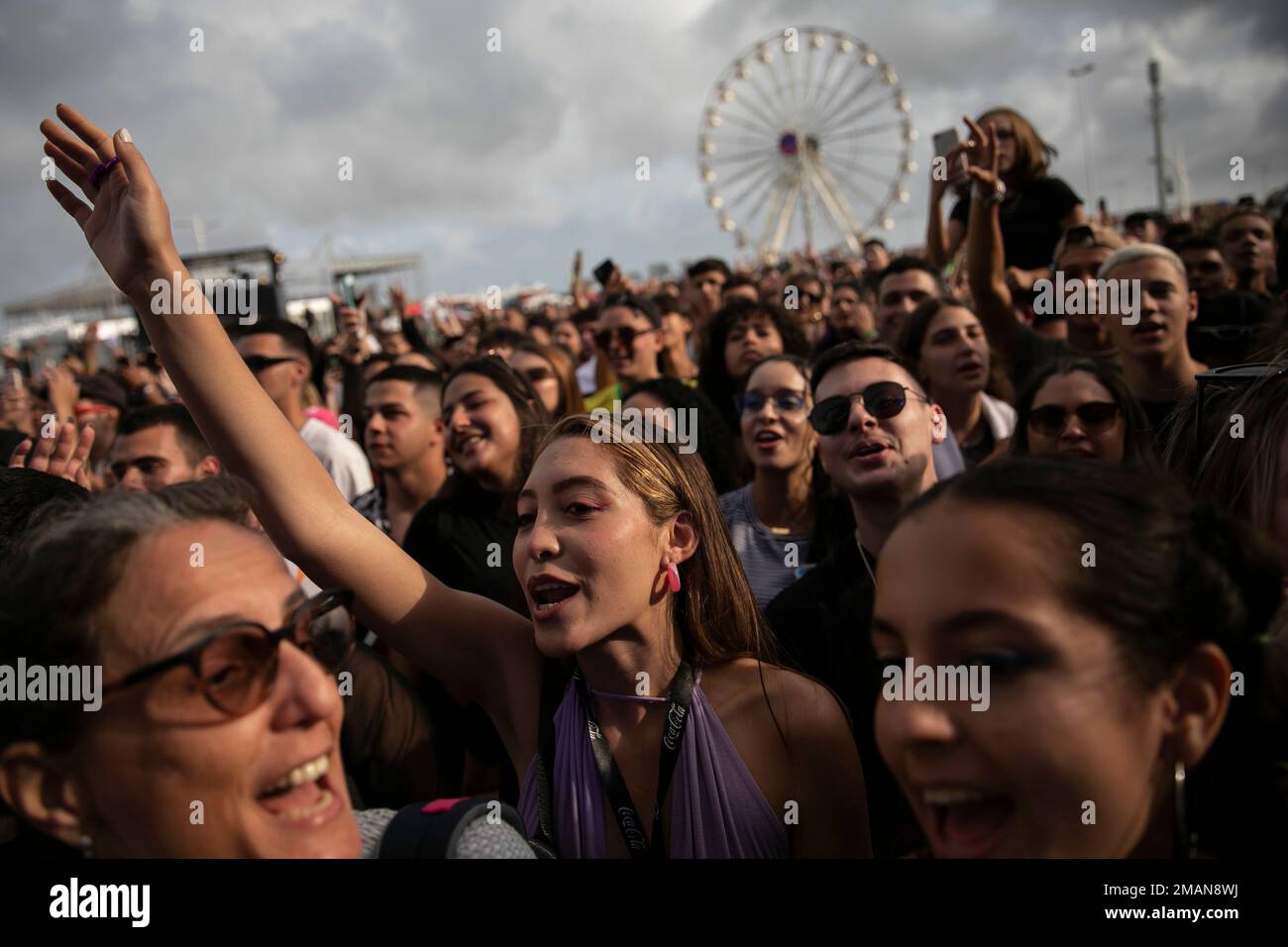 Music fans cheer during a performance at the Rock in Rio music festival ...