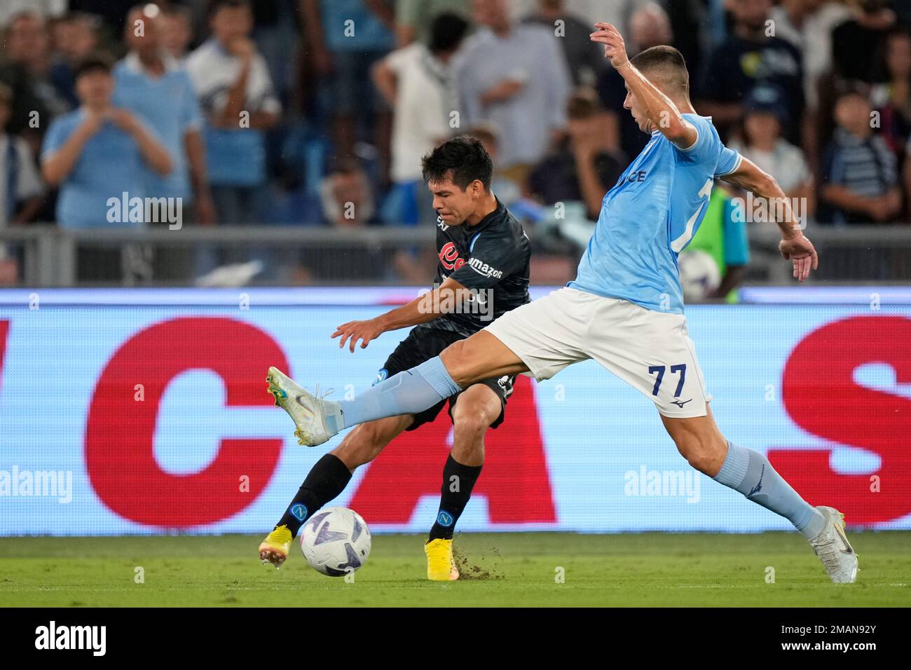 Napoli's Hirving Lozano, left, and Lazio's Adam Marusic challenge for ...