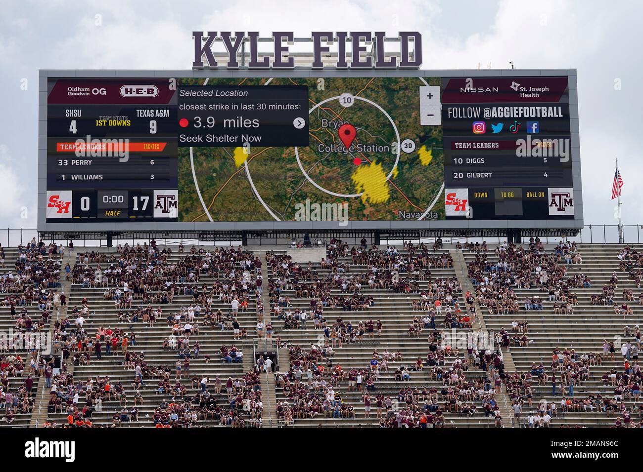 A weather warning is posted on the Kyle Field scoreboard while play is ...
