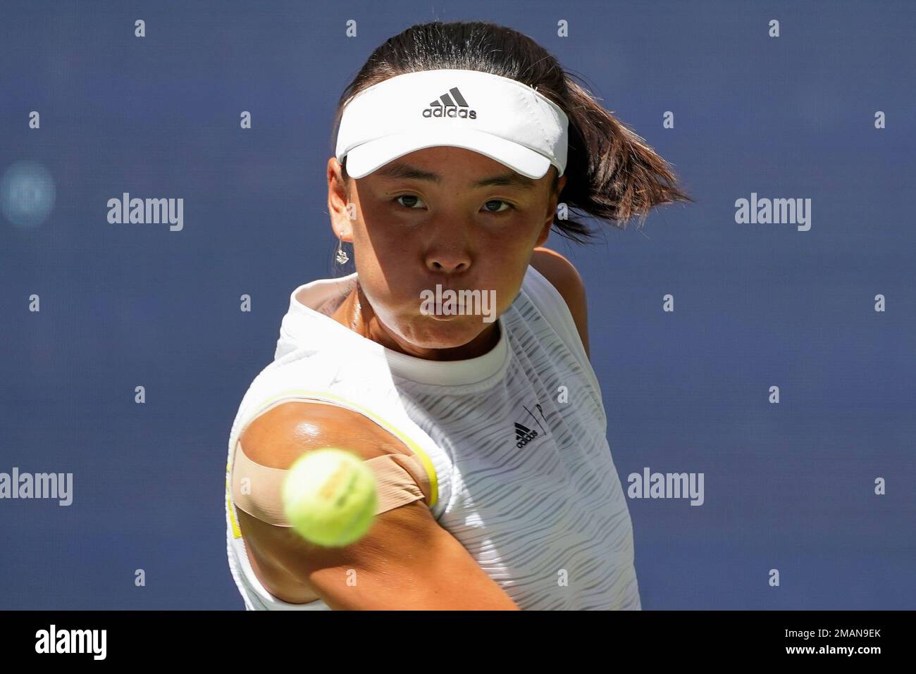 Yuan Yue, of China, returns a shot to Jessica Pegula, of the United ...