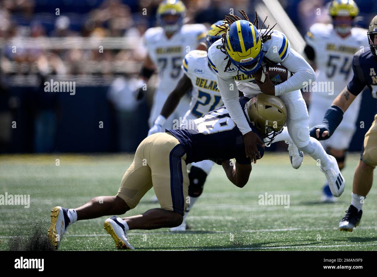 Navy safety Rayuan Lane III (18) tackles Delaware wide receiver ...