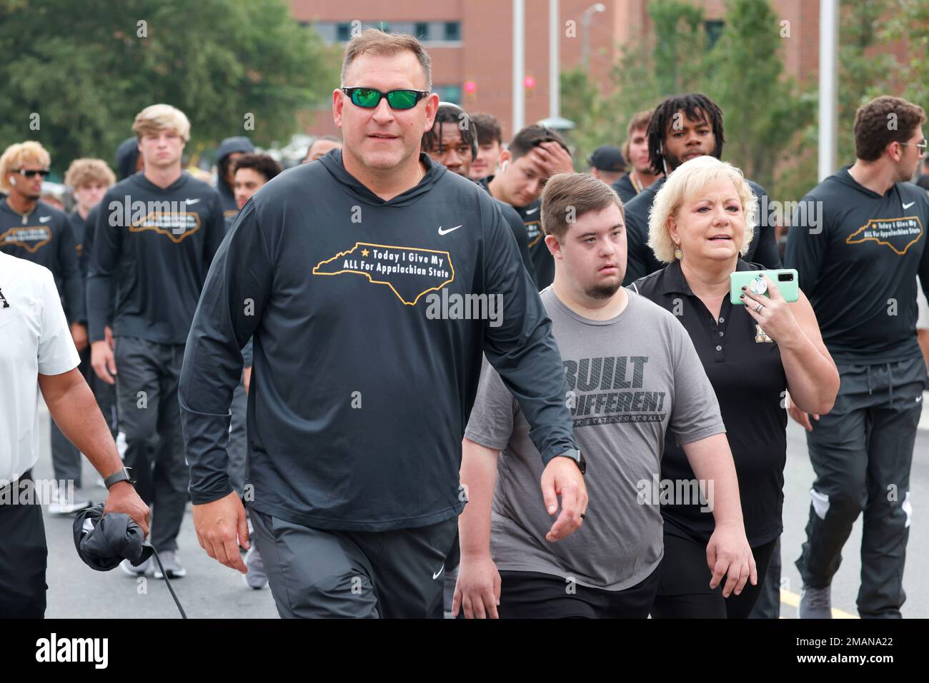 Appalachian State head coach Shawn Clark, left, leads his team on the ...