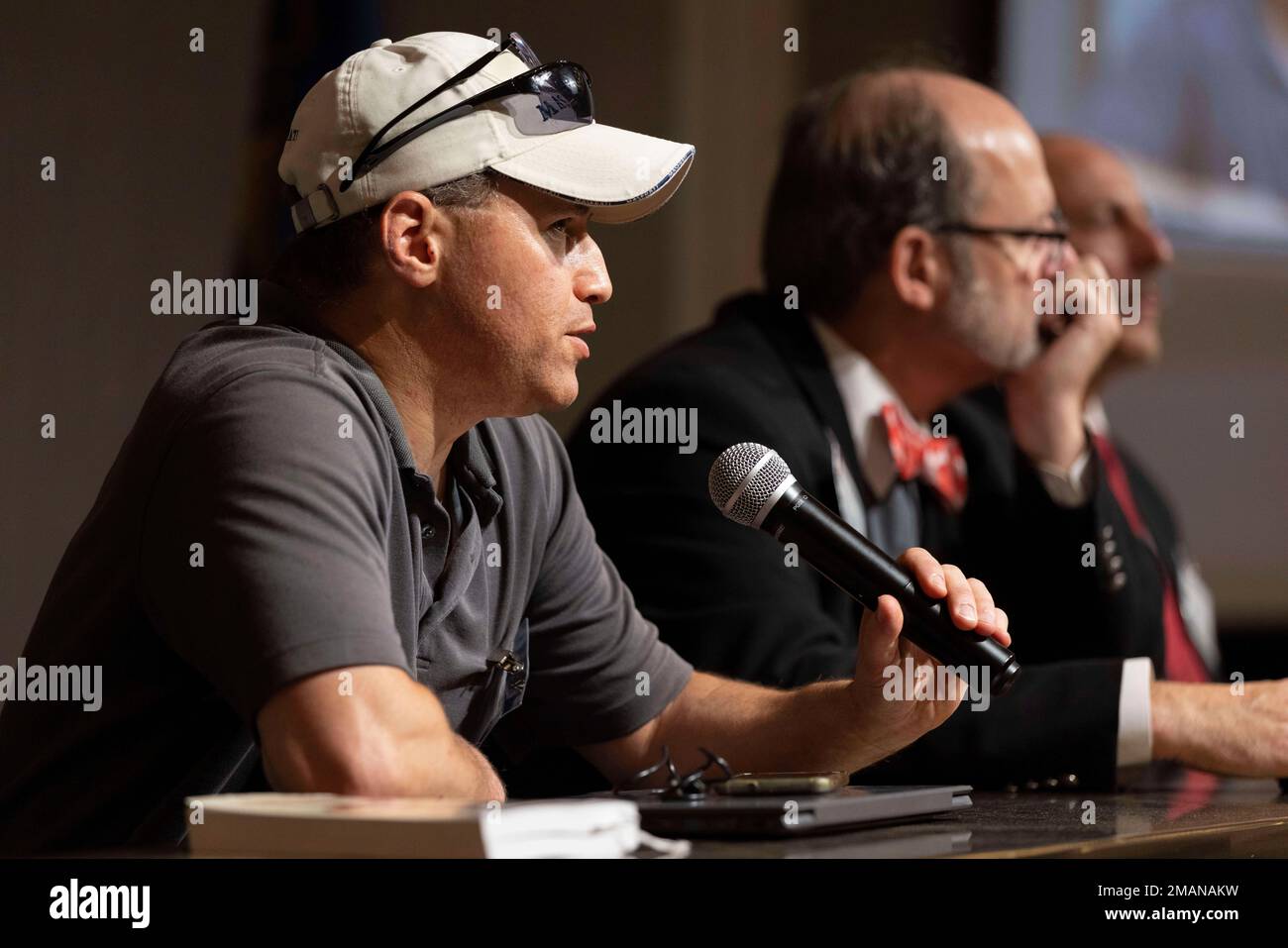 Mark Cook, left, speaks during a panel discussion alongside Douglas ...