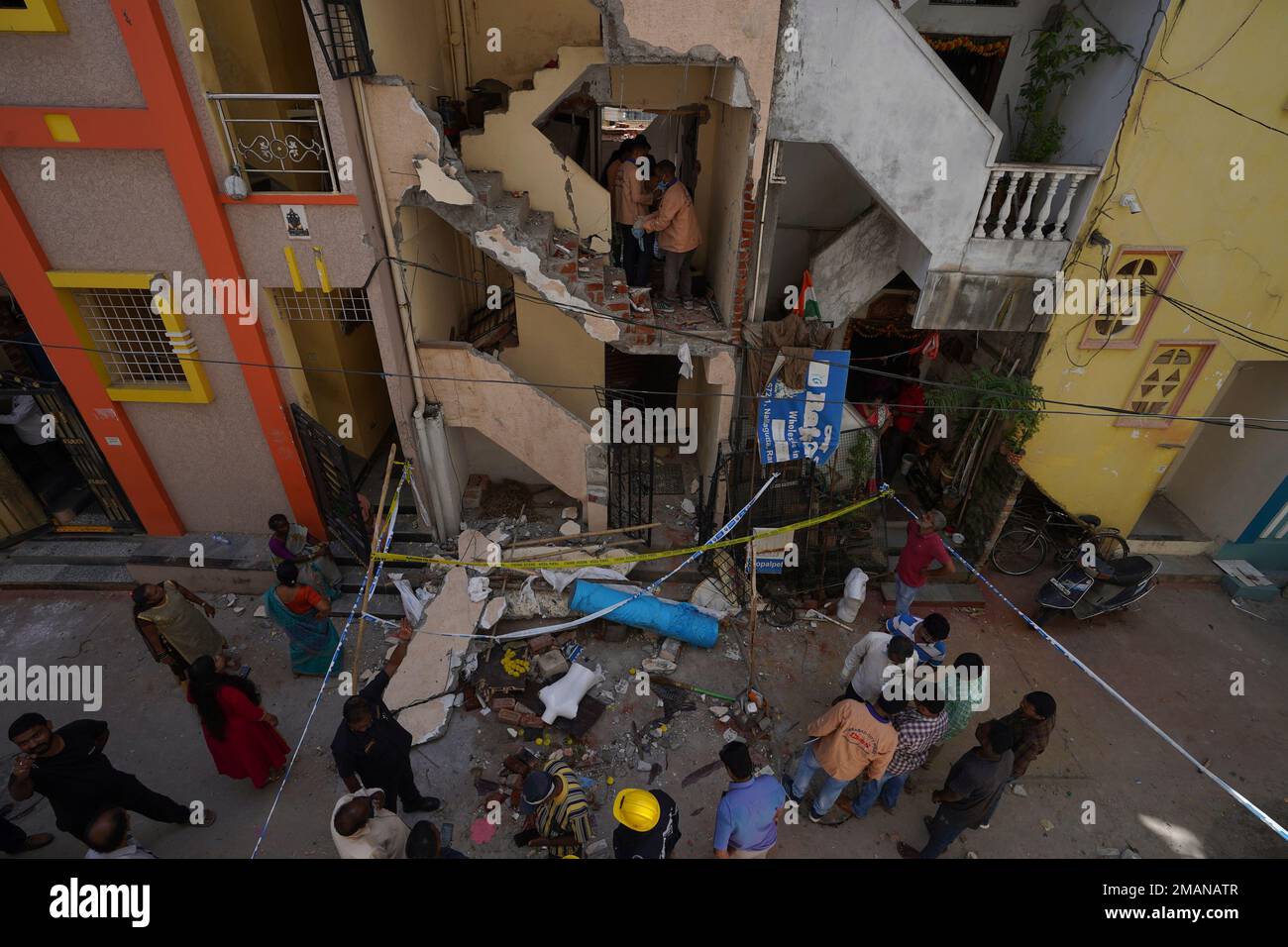 Forensic team investigates the scene after an explosion, caused by ...