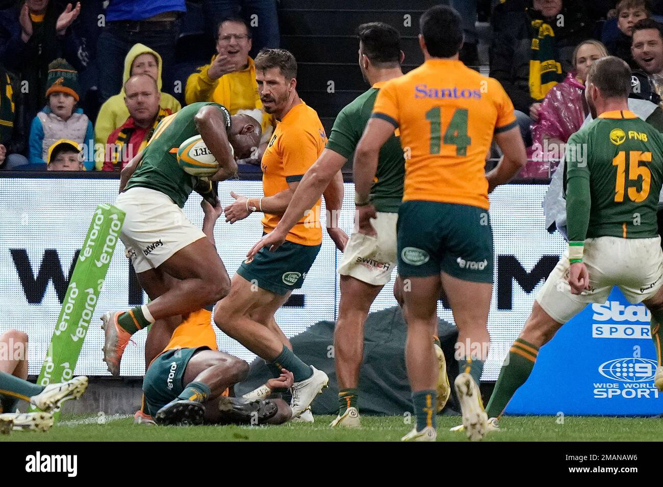 South Africa's Makazole Mapimpi, left, stands over Australia's Marika ...