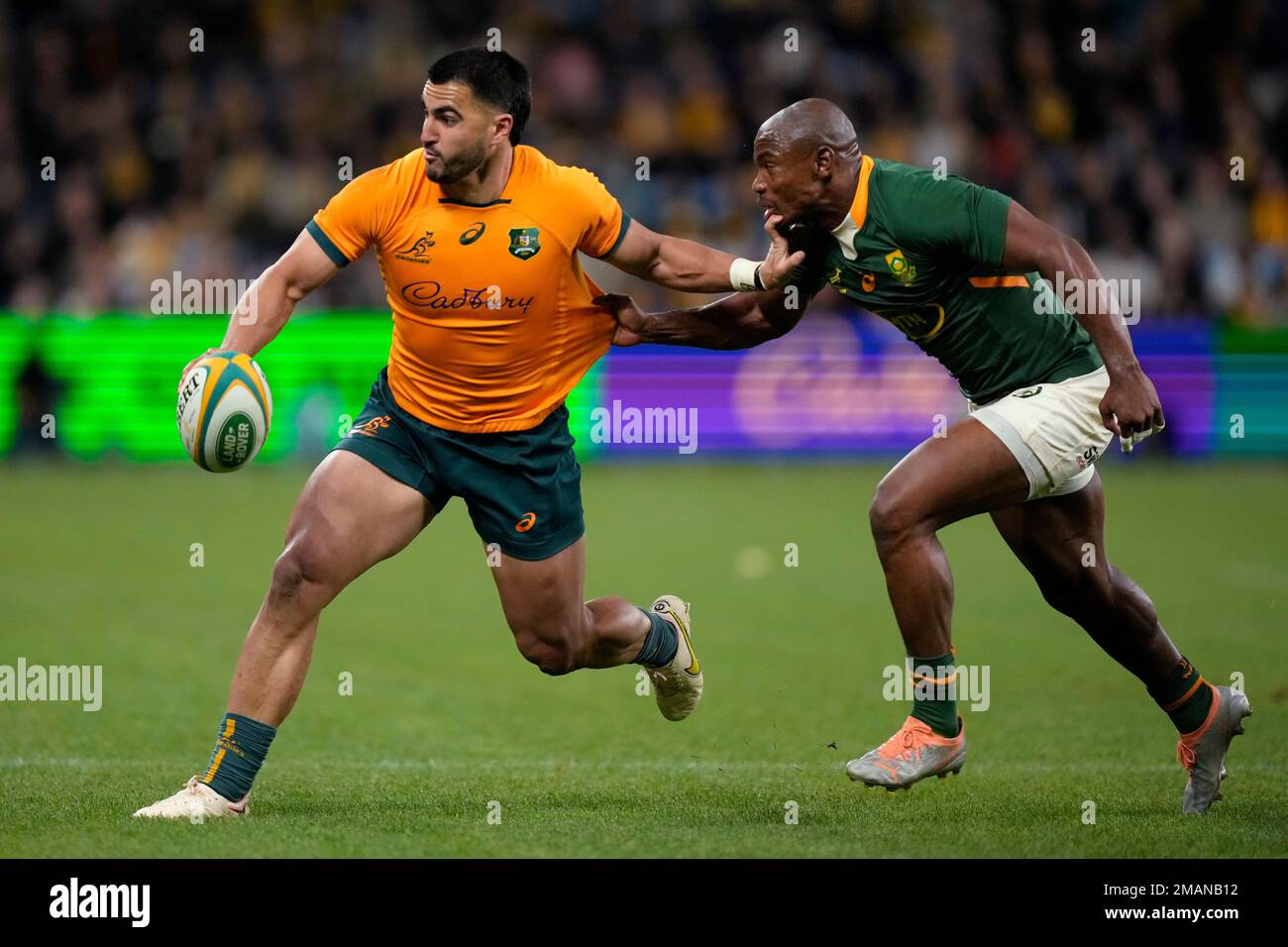 Australia's Tom Wright, left, is grabbed by South Africa's Makazole ...