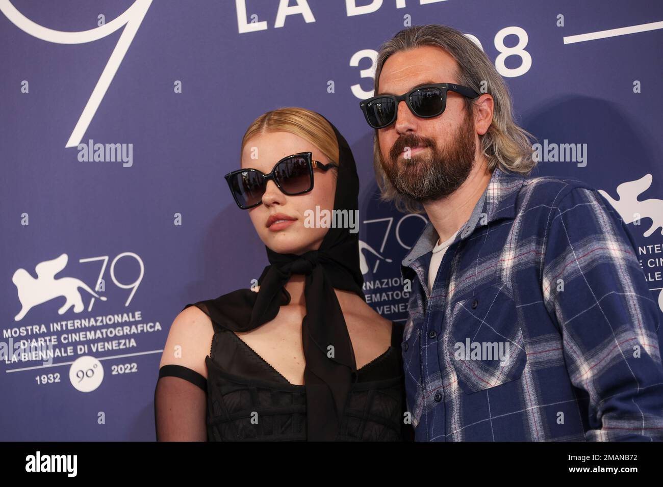 Mia Goth, left, and director Ti West pose for photographers at the ...