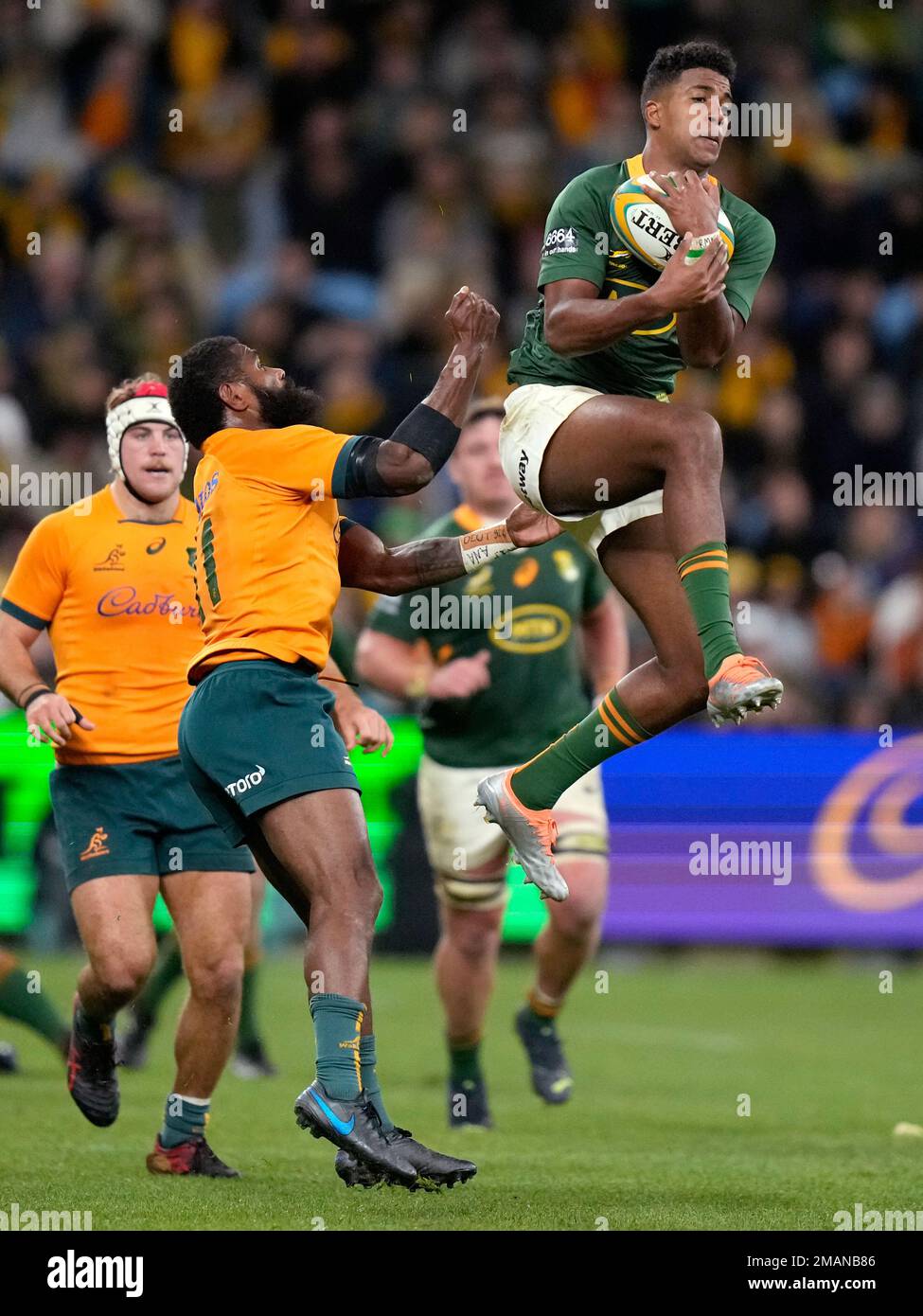 South Africa's Canan Moodie, right, jumps for a high ball in front of ...