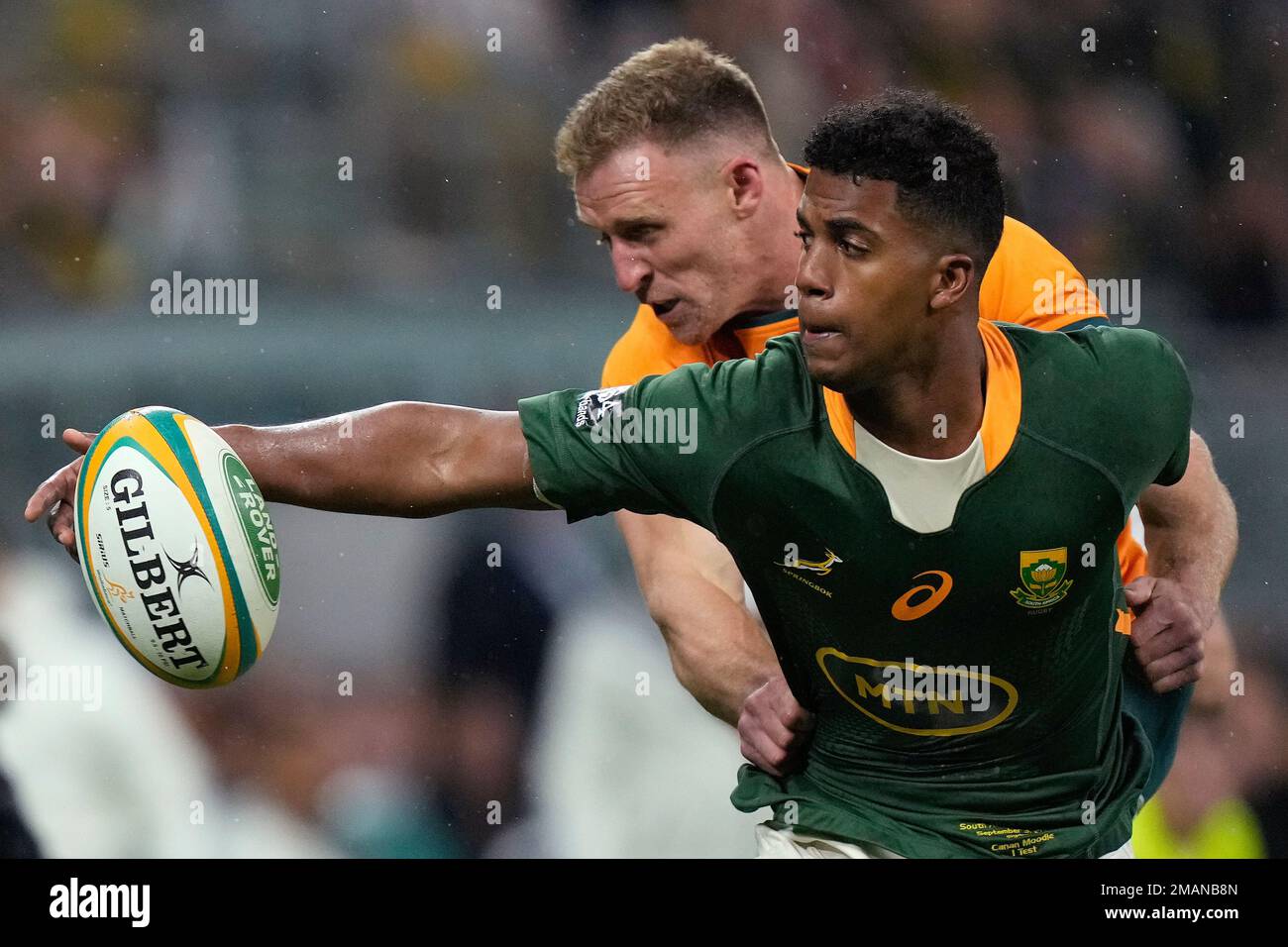 South Africa's Canan Moodie, right, reaches out for the ball in front ...