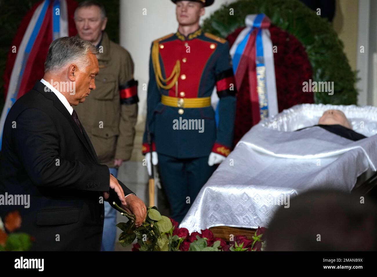 Hungary's Prime Minister Viktor Orban lays flowers to the coffin of ...