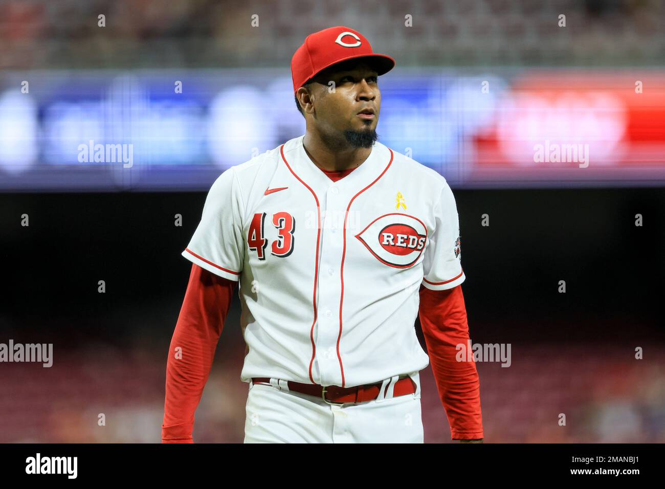Cincinnati Reds' Alexis Diaz walks to the dugout during a baseball game ...