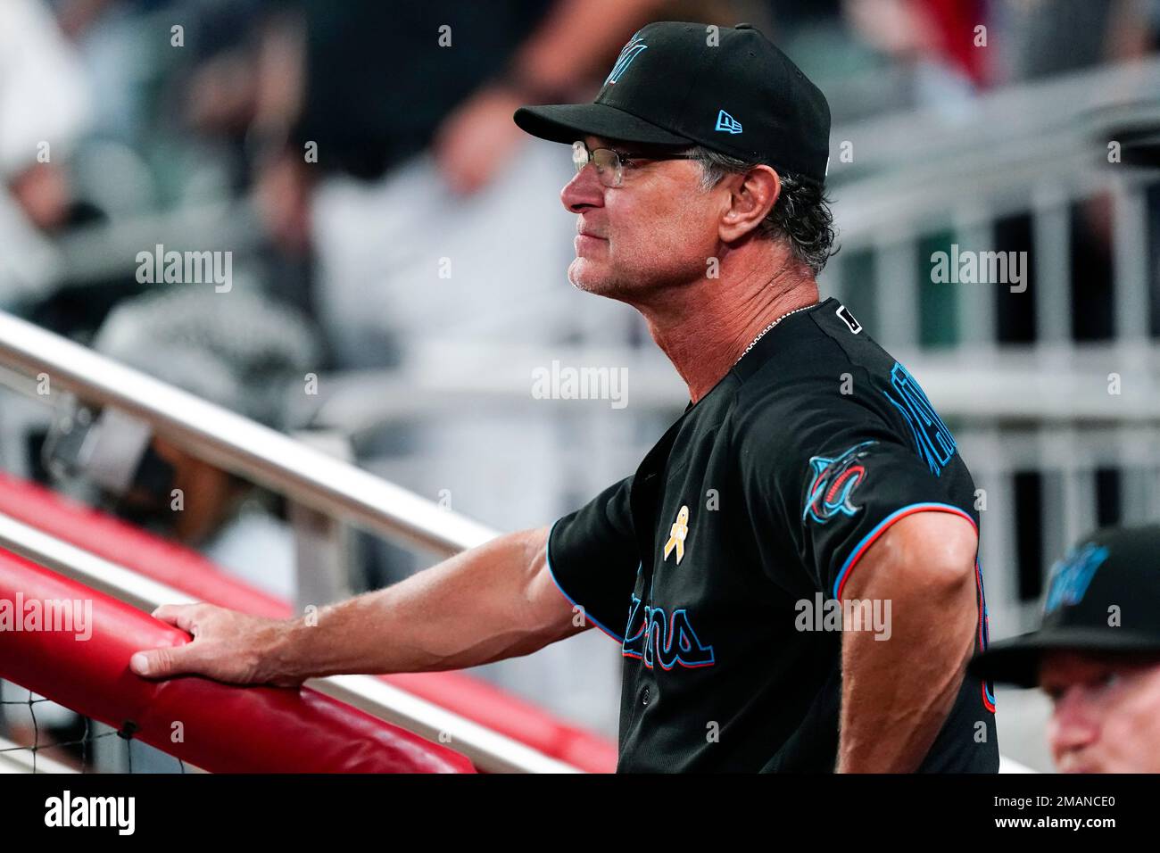 Miami Marlins manager Don Mattingly looks on from the dugout during a ...