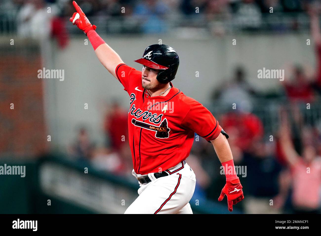 Atlanta Braves third baseman Austin Riley (27) reacts after hitting a ...