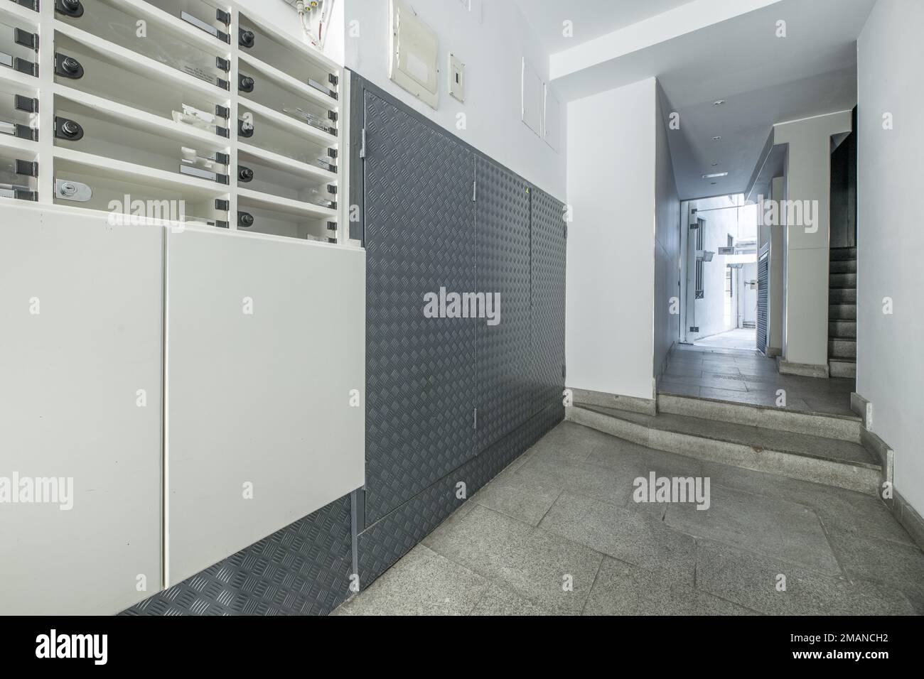 Access portal to a building with granite tiles on the stairs to access ...