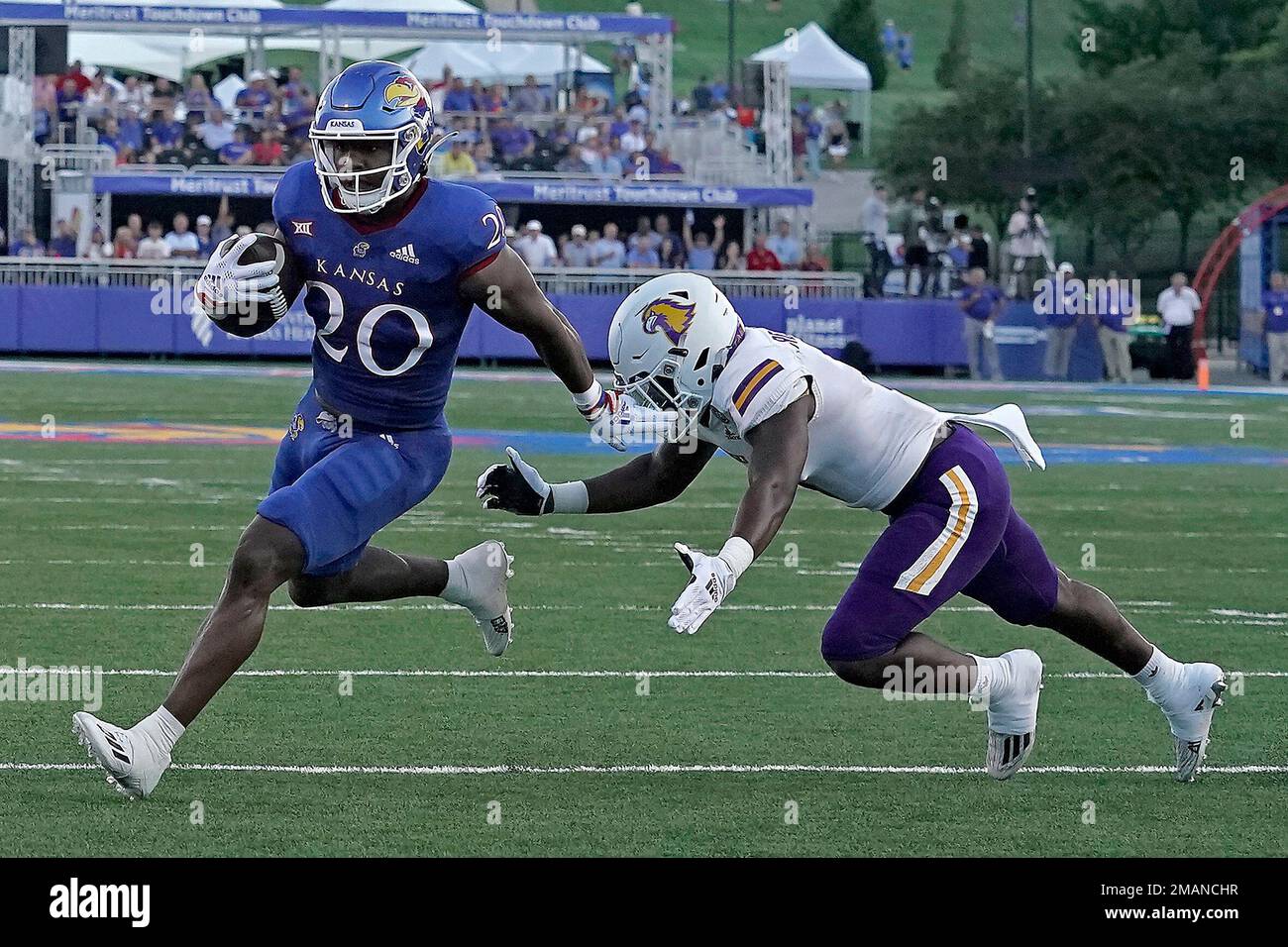 Kansas running back Daniel Hishaw Jr. (20) gets past Tennessee Tech ...