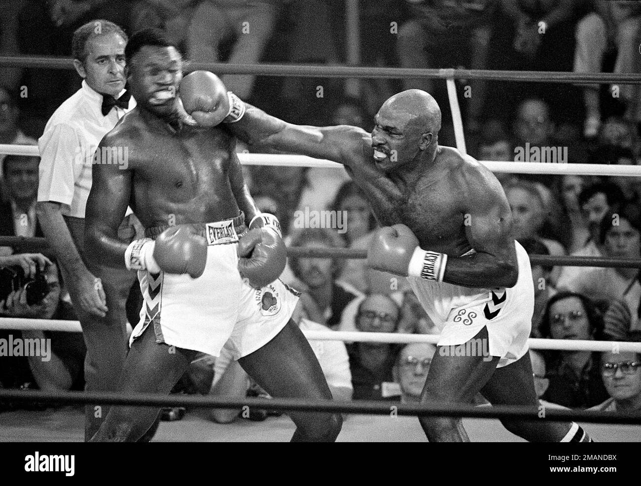 FILE - Challenger Earnie Shavers drives a right hand to the head of ...