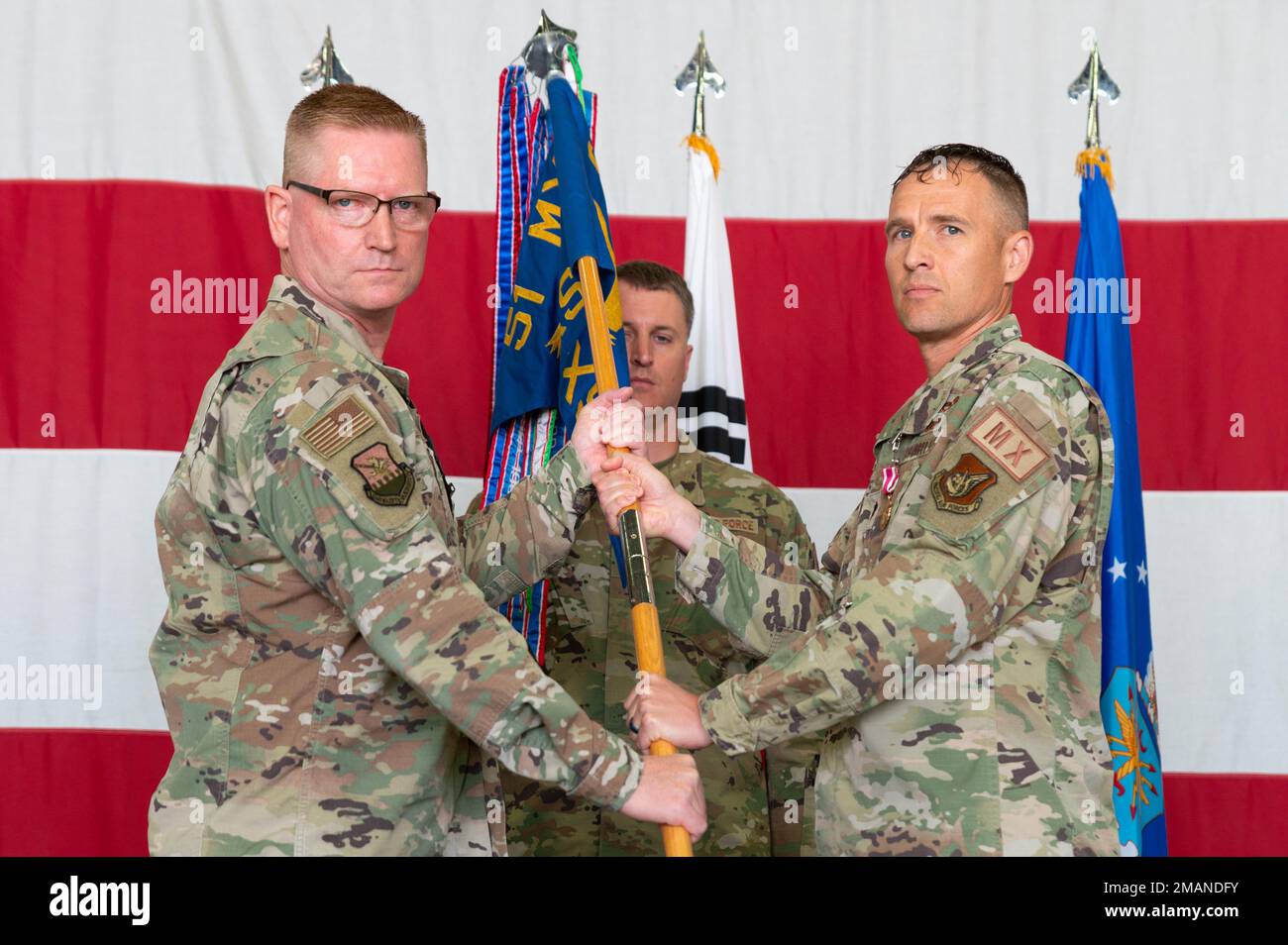 Col. Brian D. Moore, 51st Maintenance Group commander, left, recives ...