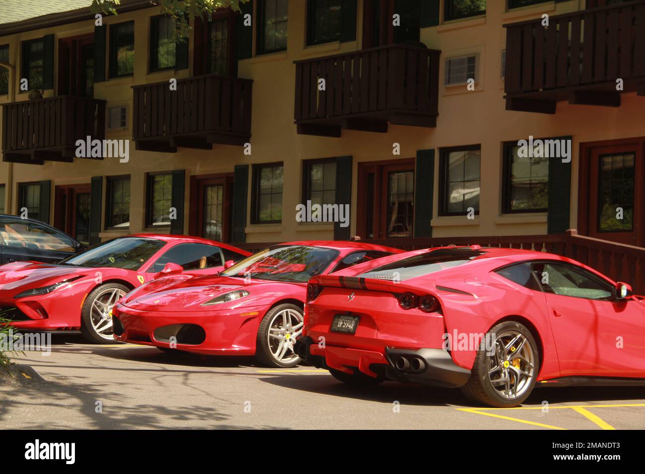 Several Ferrari vehicles parked outside a hotel in the U.S.A Stock ...