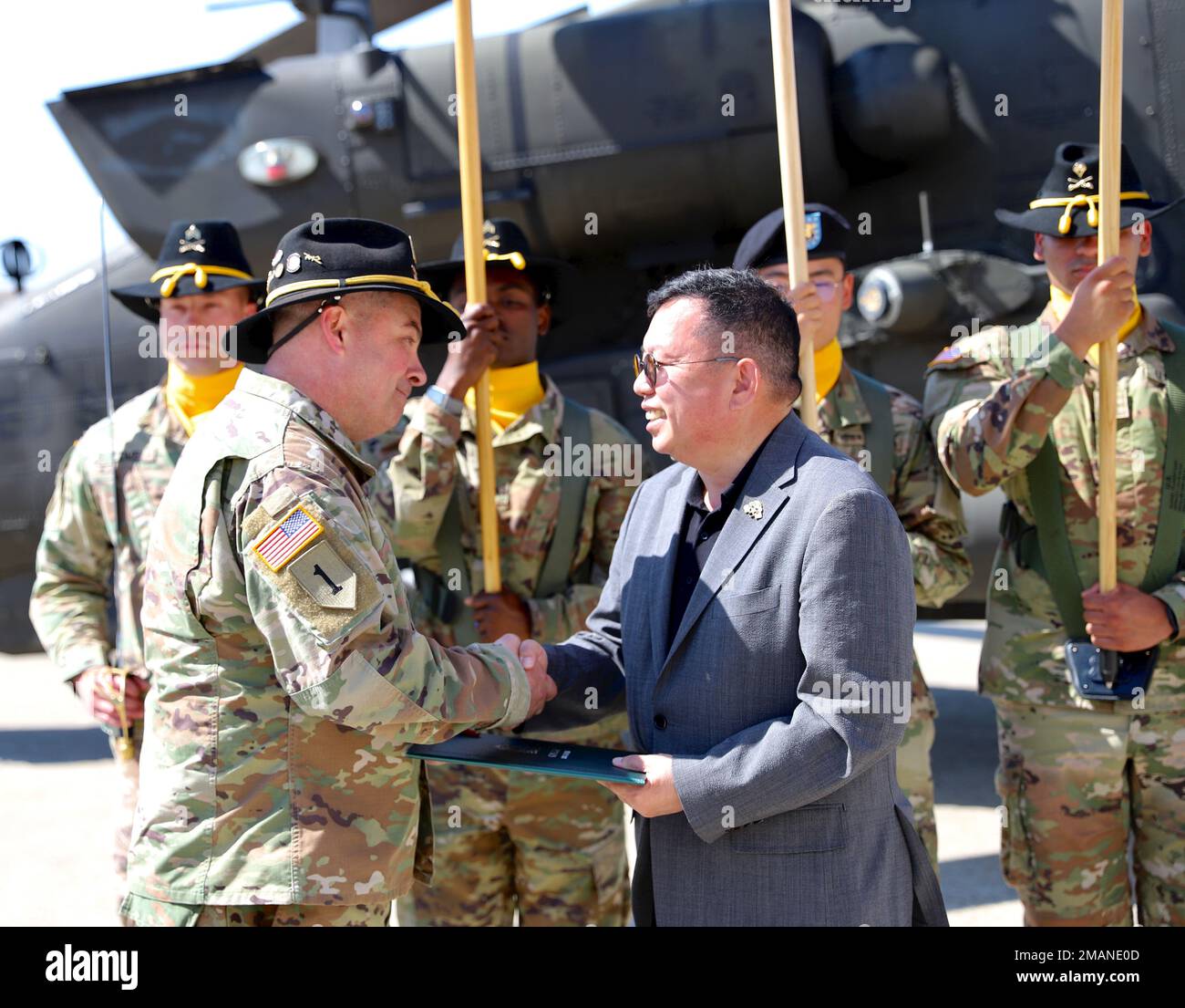 Command Sgt. Maj. Brian Blomberg receives an award from Lt. Gen. (Ret ...