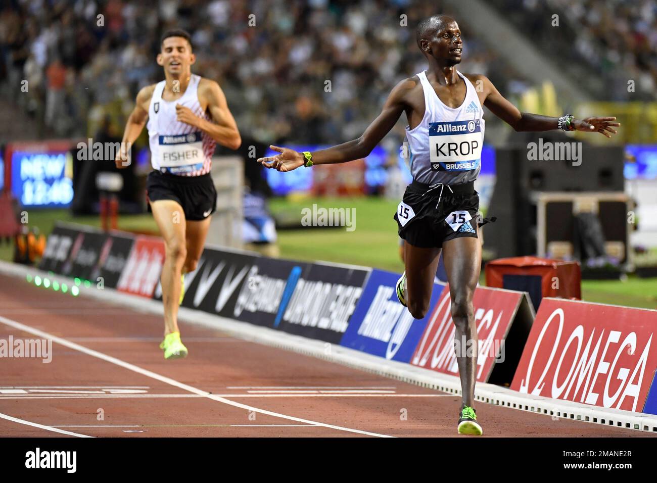 Kenya's Jacob Krop, right, crosses the finish line to win the men's ...